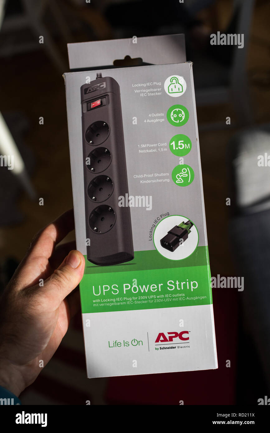 PARIS, FRANCE - MAR 31, 2018: Man holding against messy table ...