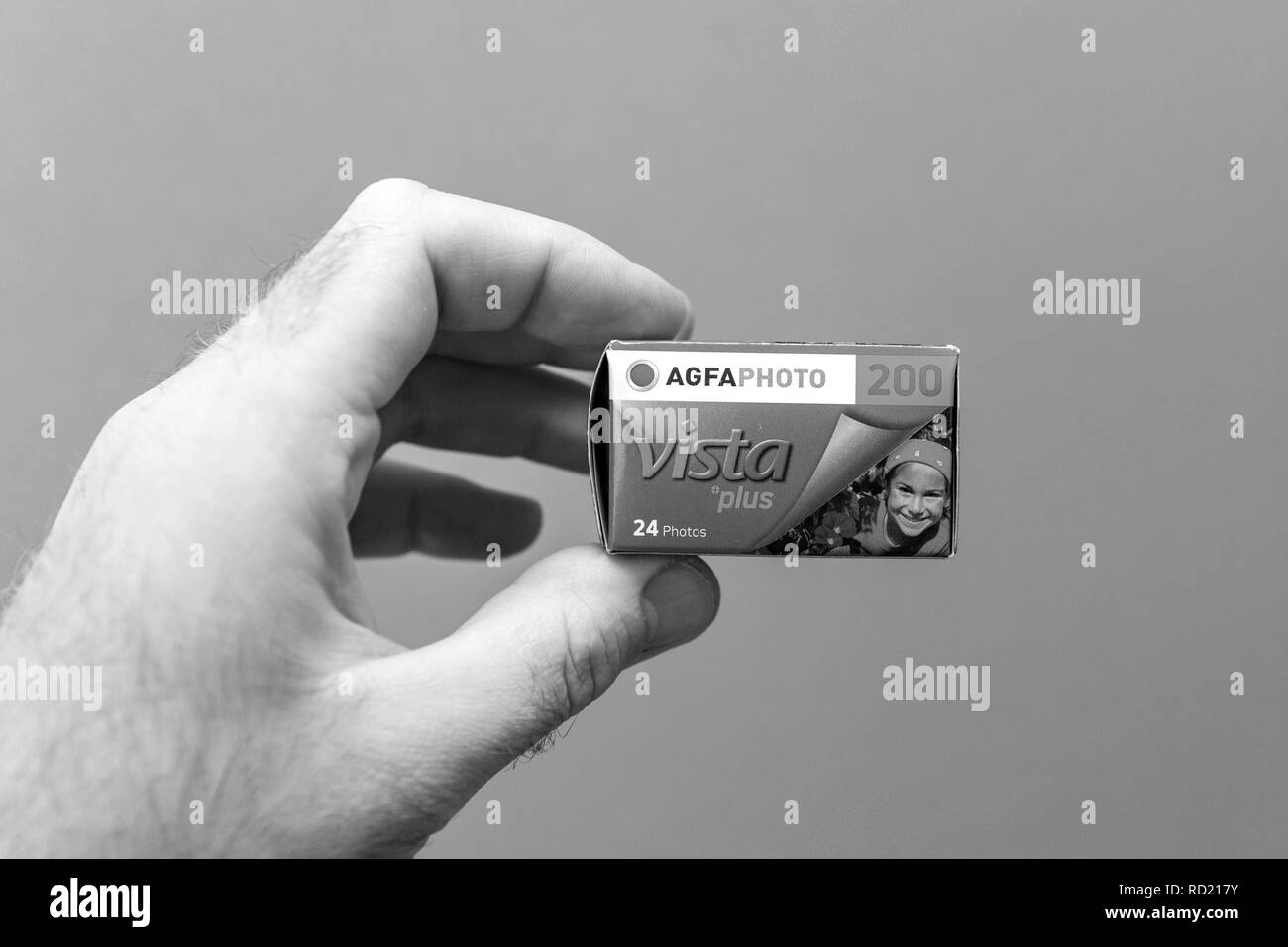 PARIS, FRANCE - MAR 24, 2018: Man holding against gray background AGFA ...