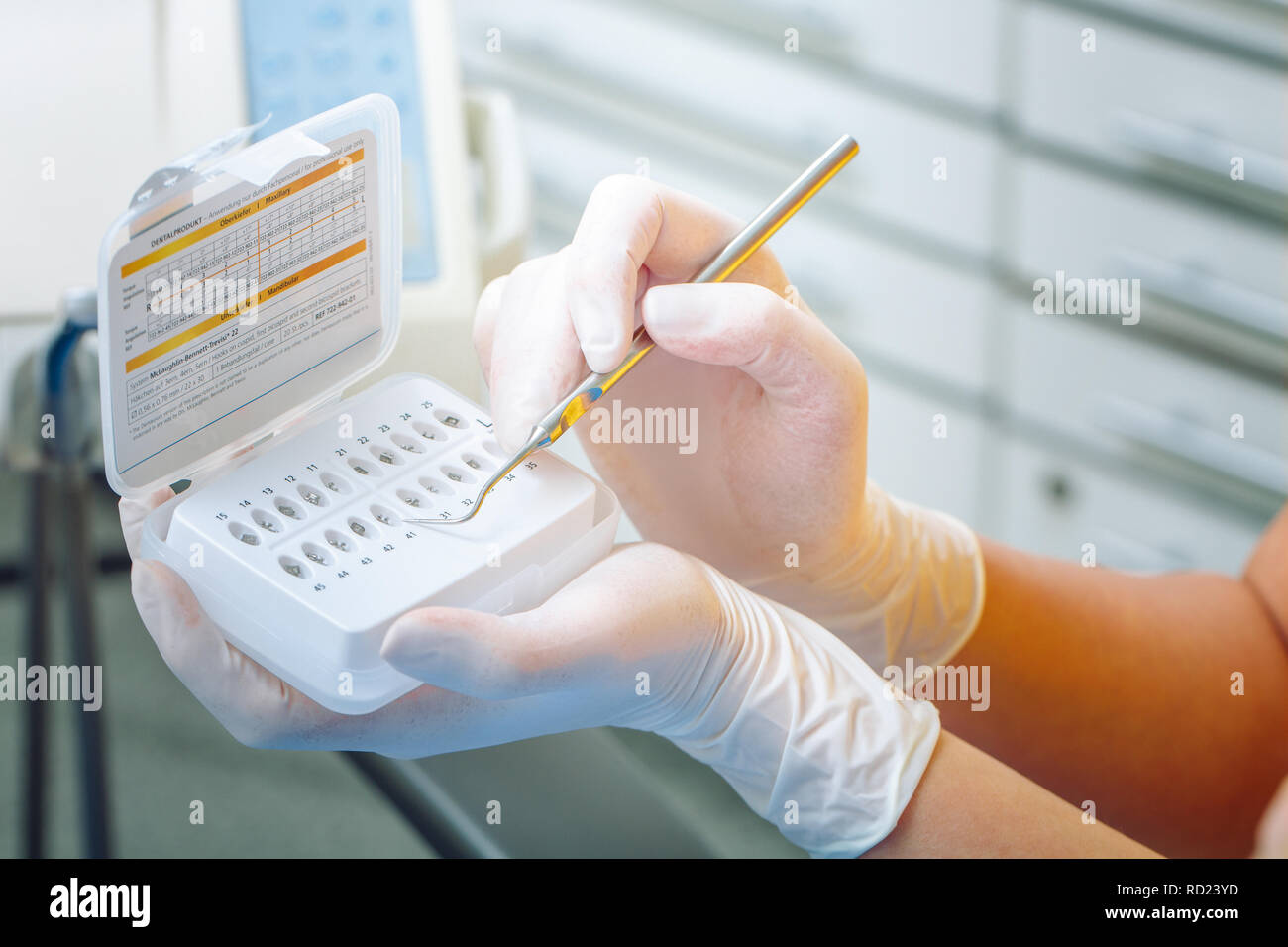 Dental concept. Braces for teeth close up. Dentist takes the lock for ...