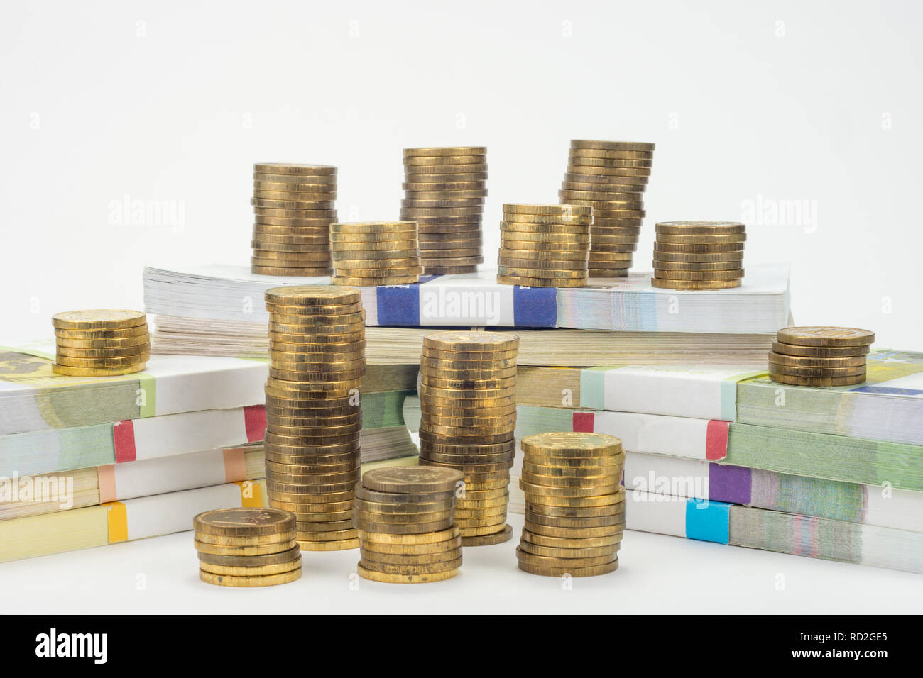 Bundles of bills around are stacks of coins Stock Photo - Alamy