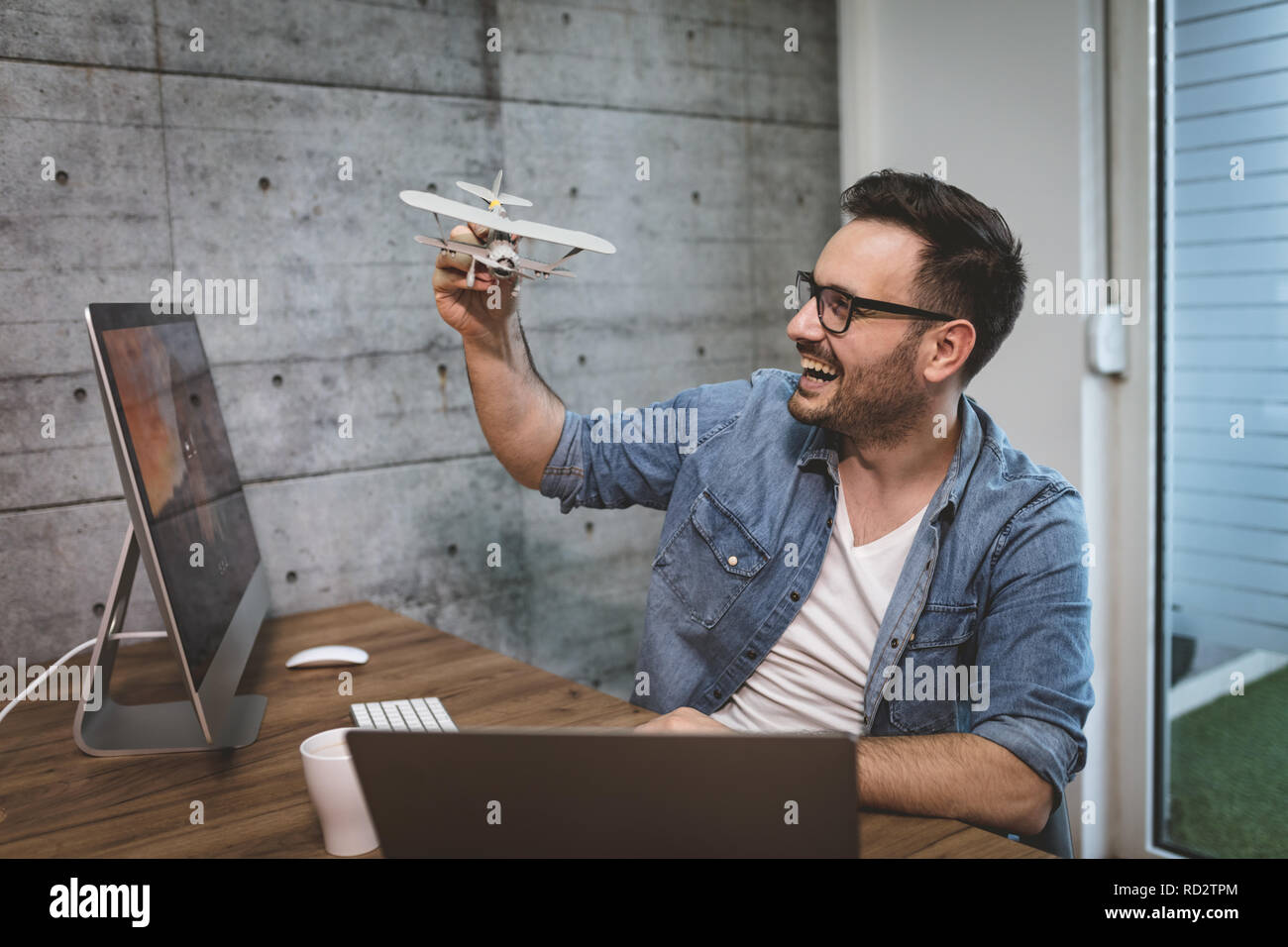 Young handsome successful smiling freelance entrepreneur having fun and ...