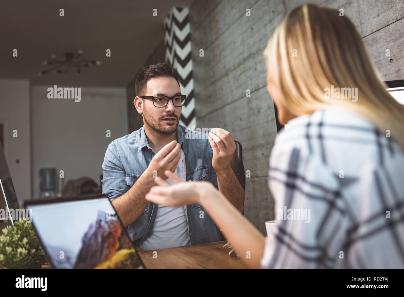 Young successful pensive engineers colleagues talking while working on ...