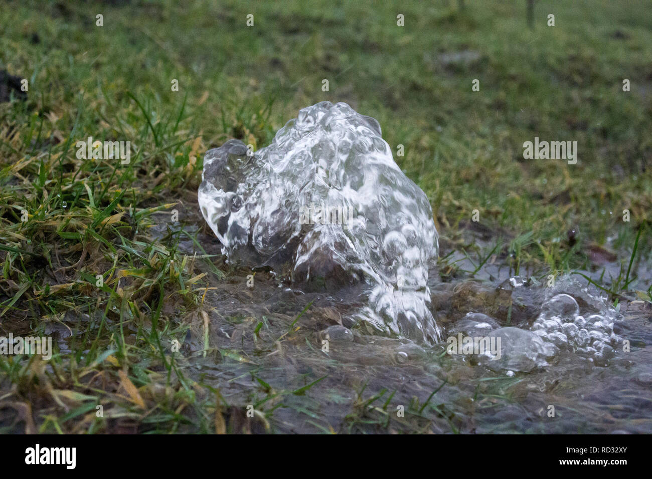 Water bursting out of a field dran on a wet day in the Yorkshire Dales ...