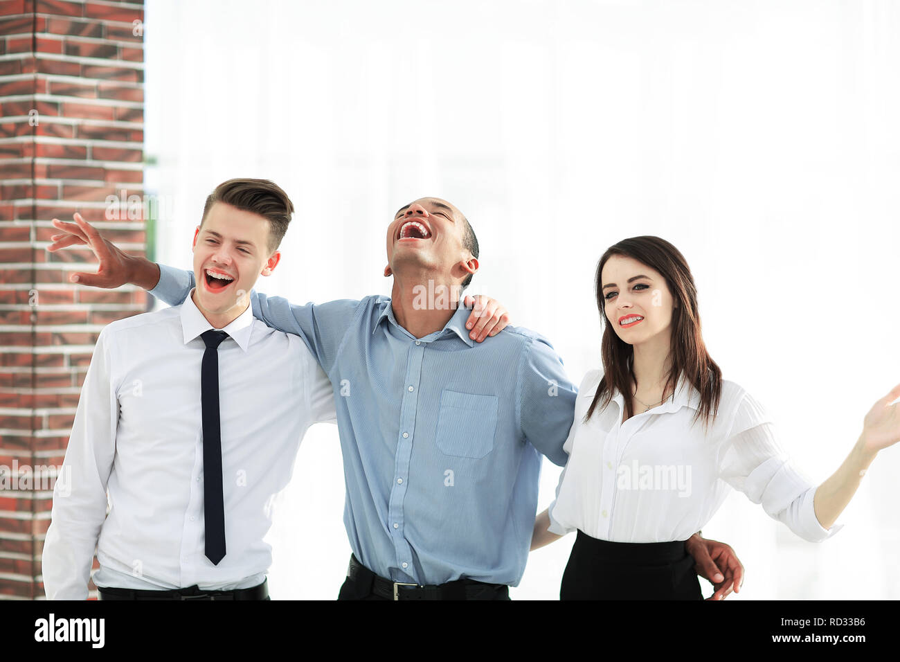 triumphant business team on office background. concept of victory Stock ...