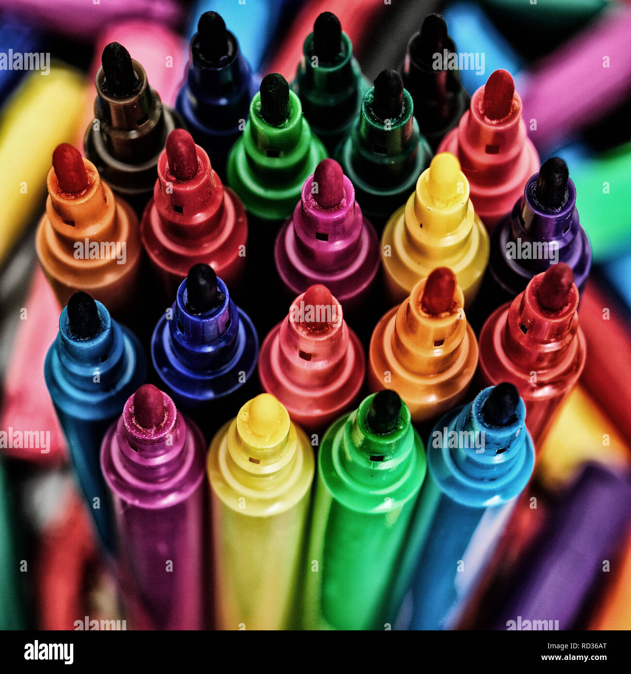 Dozens of multi-colored felt tipped pens, a high contrast colorful with ...