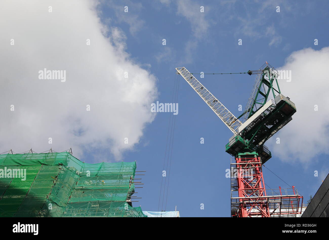 Construction crane and buildings Stock Photo - Alamy