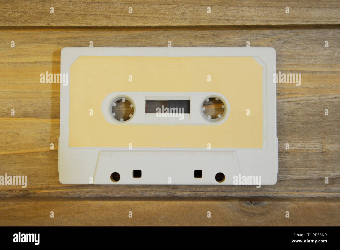 Old tapes cassettes for recording on wooden background Stock Photo - Alamy