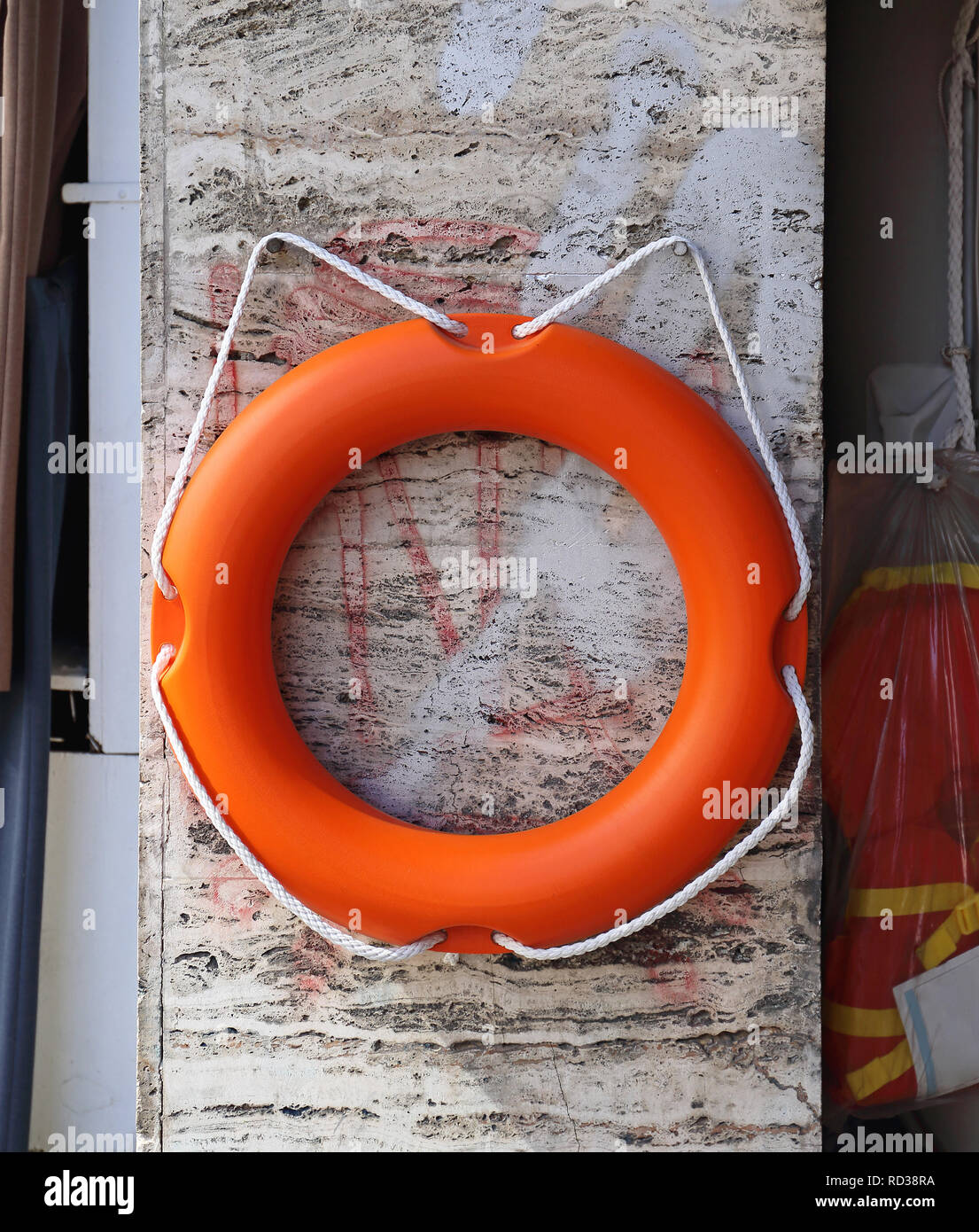 Life Ring Saver Orange Plastic at Wall Stock Photo - Alamy