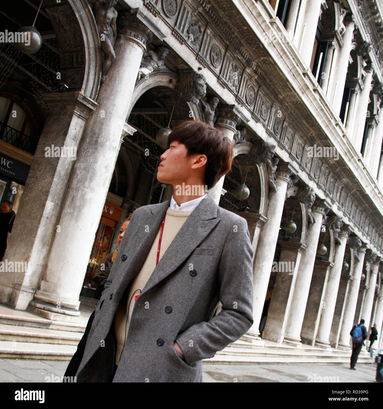 Elegant chinese man walking in street in Venice. Italy Stock Photo - Alamy