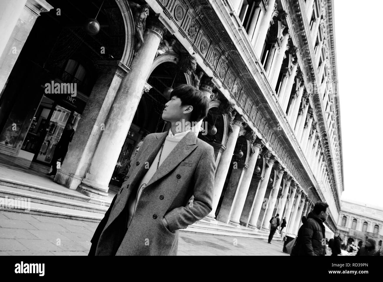 Elegant chinese man walking in street in Venice. Italy Stock Photo - Alamy
