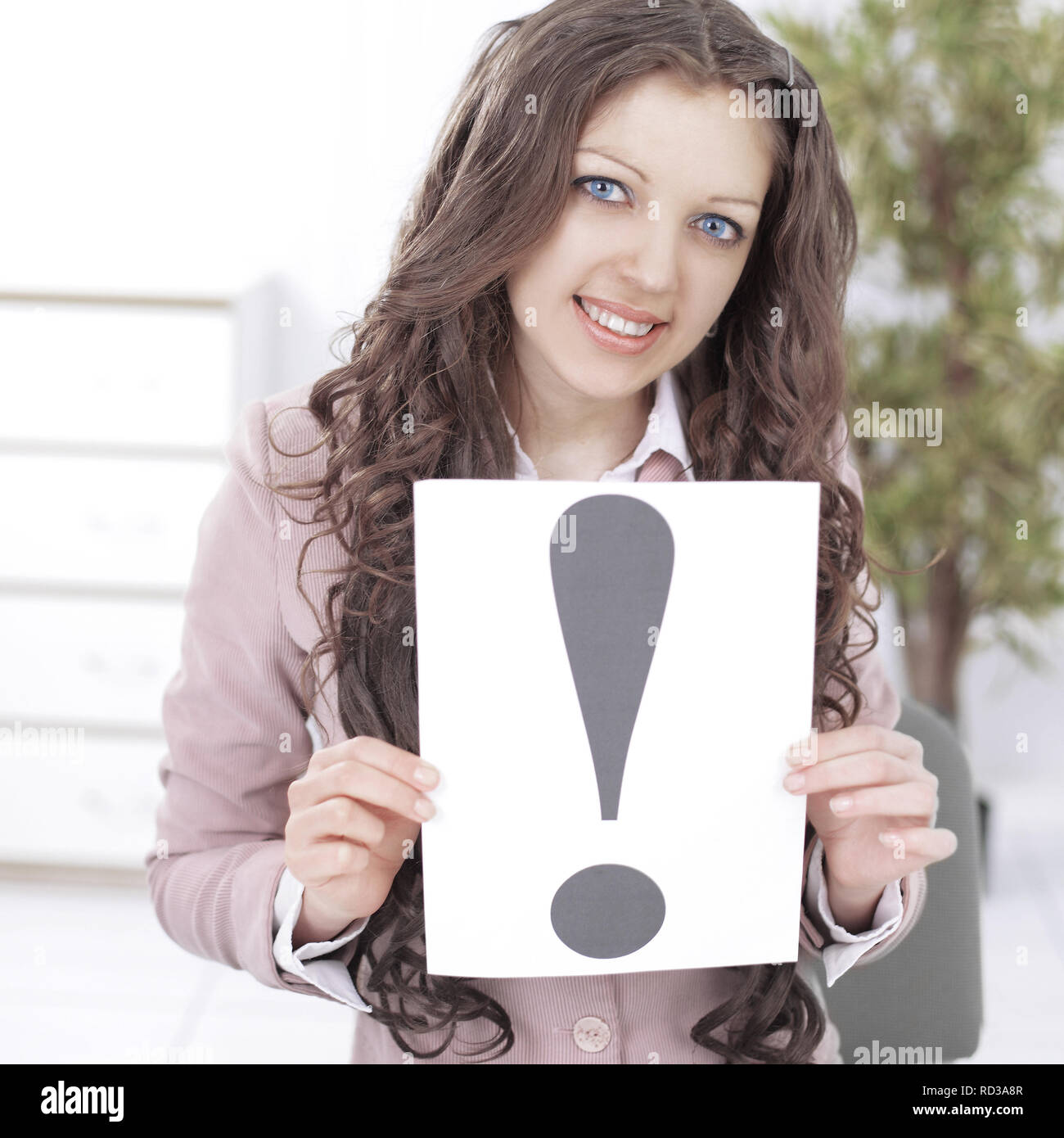 Business woman with an exclamation point in the office Stock Photo - Alamy