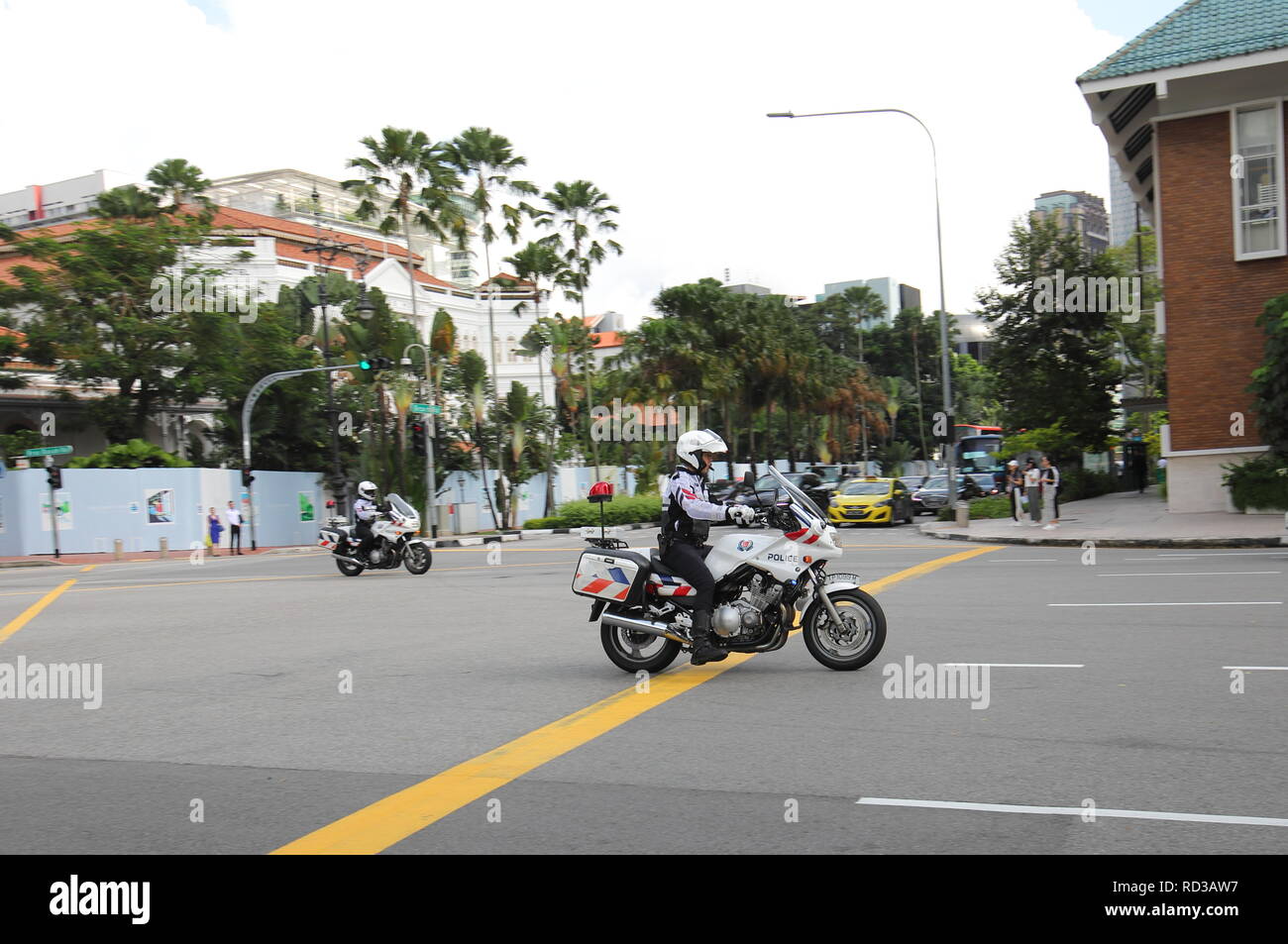 Police officer ride motorbike in downtown Singapore Stock Photo - Alamy