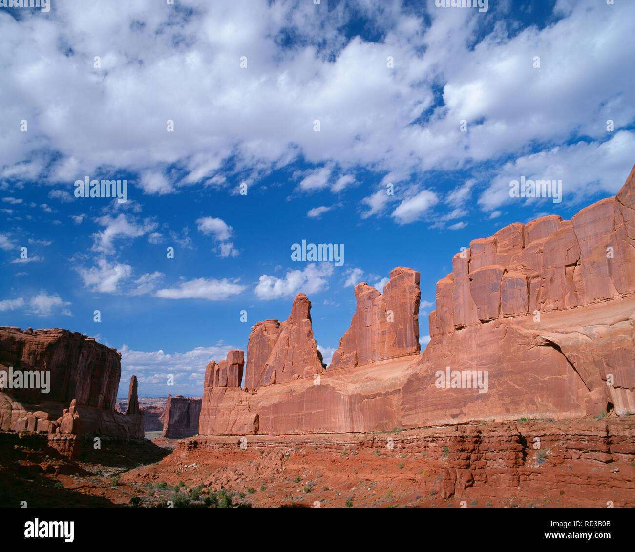 USA, Utah, Arches National Park, Cumulus clouds gather over steep fins ...