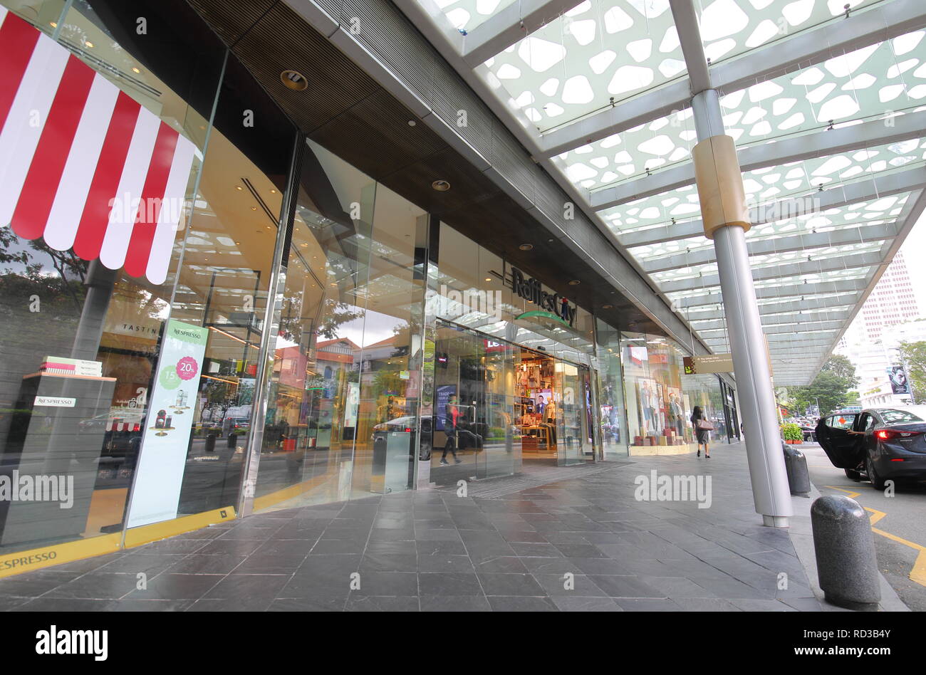 People visit Raffles City Shopping mall in Singapore Stock Photo - Alamy