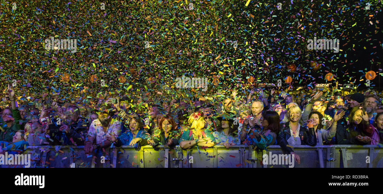 Confetti cannons throwing confetti onto the crowd at a music festival ...