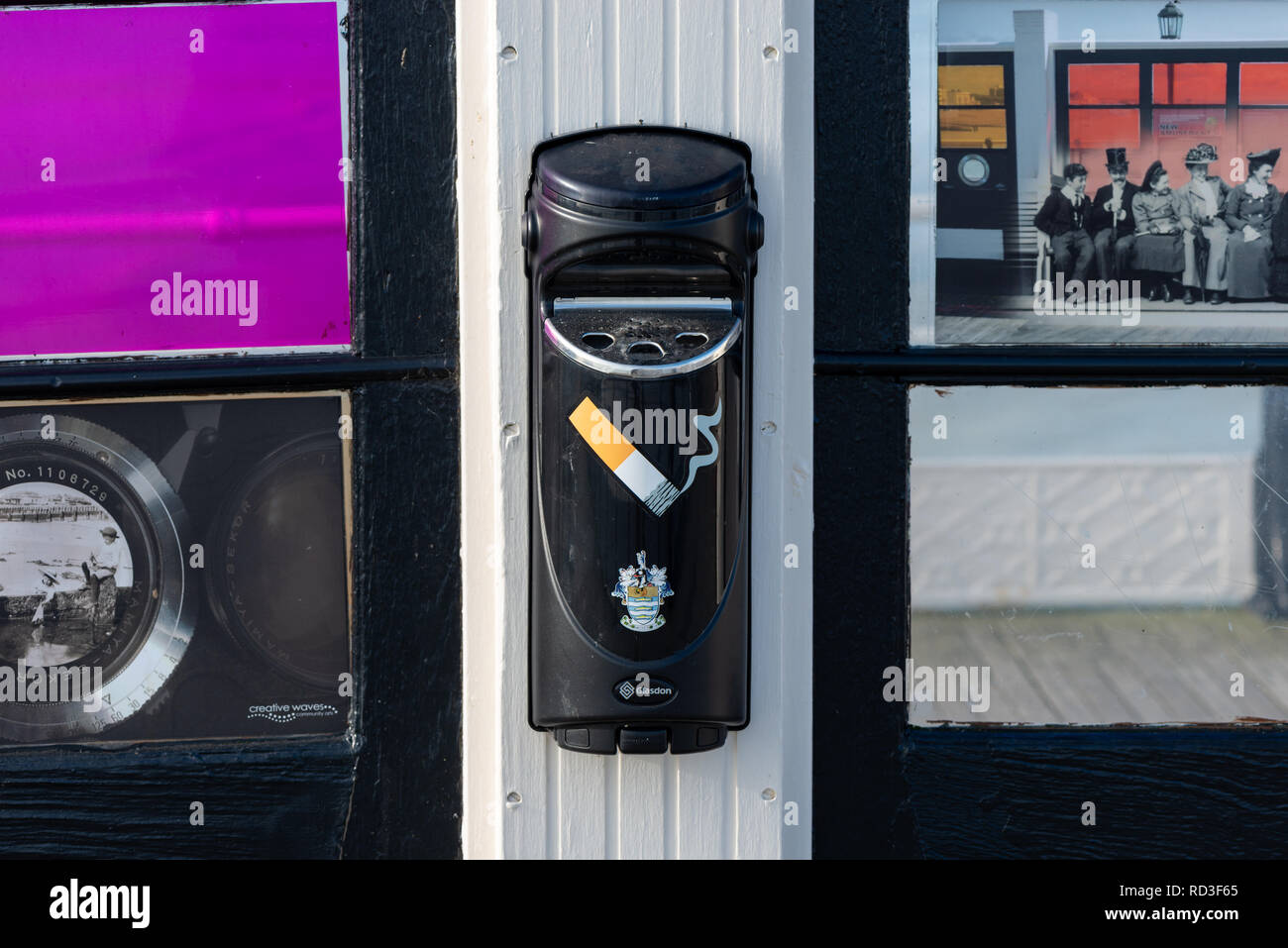 A cigarette bin on a wall Stock Photo - Alamy