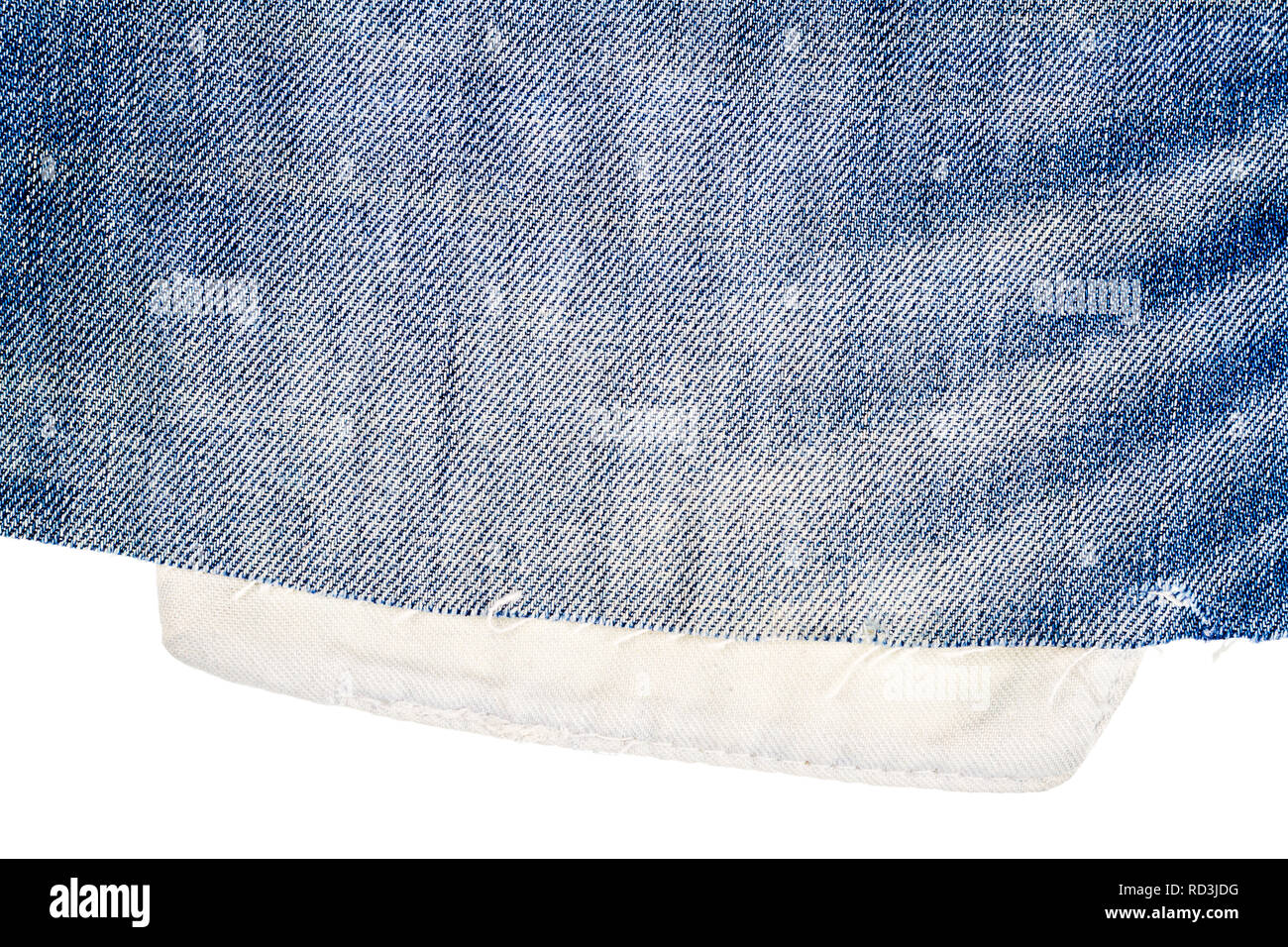 Piece of blue jeans fabric isolated on white background. Rough uneven ...