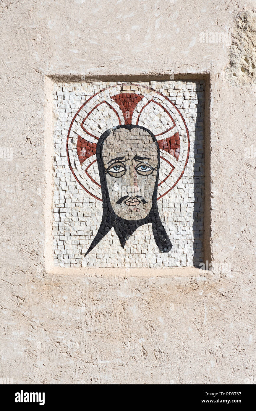 Religious image or mosaic of Jesus crying within the castle at Alicante ...