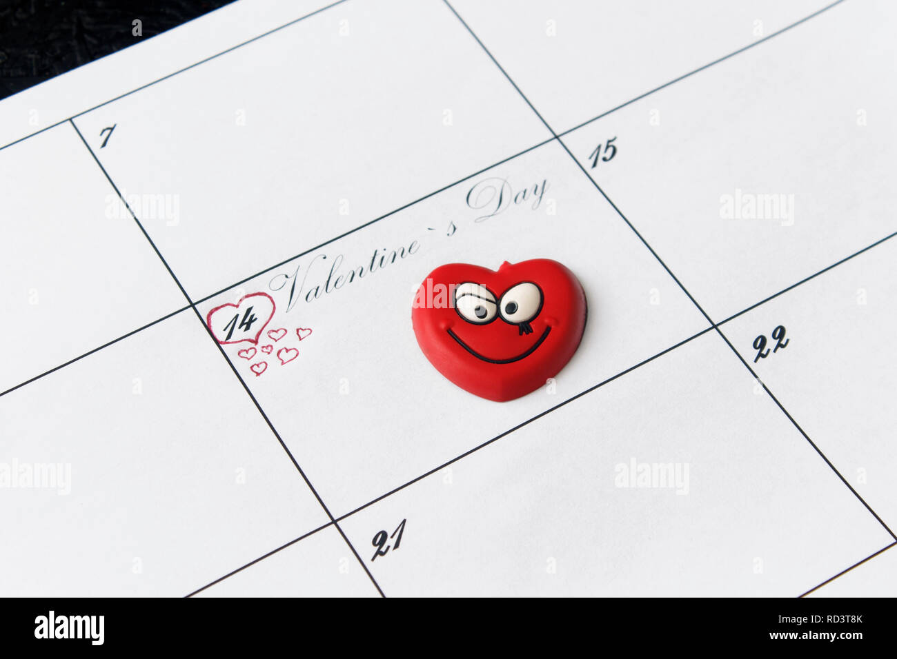 Calendar page with red hearts on February 14, Valentine's Day on a ...