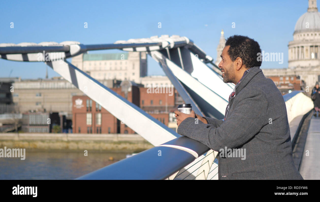 African black man enjoys the view over River Thames London from ...