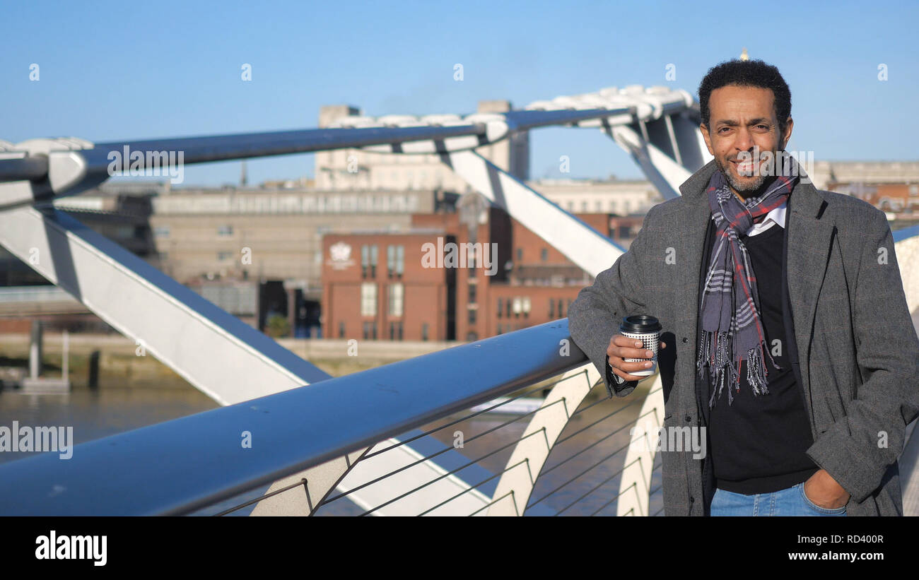 African black man enjoys the view over River Thames London from ...