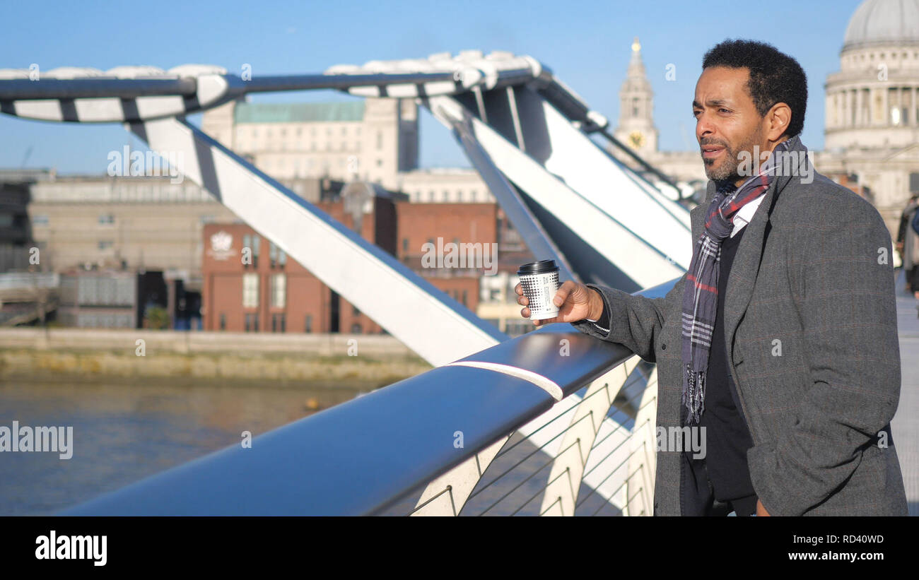 African black man enjoys the view over River Thames London from ...