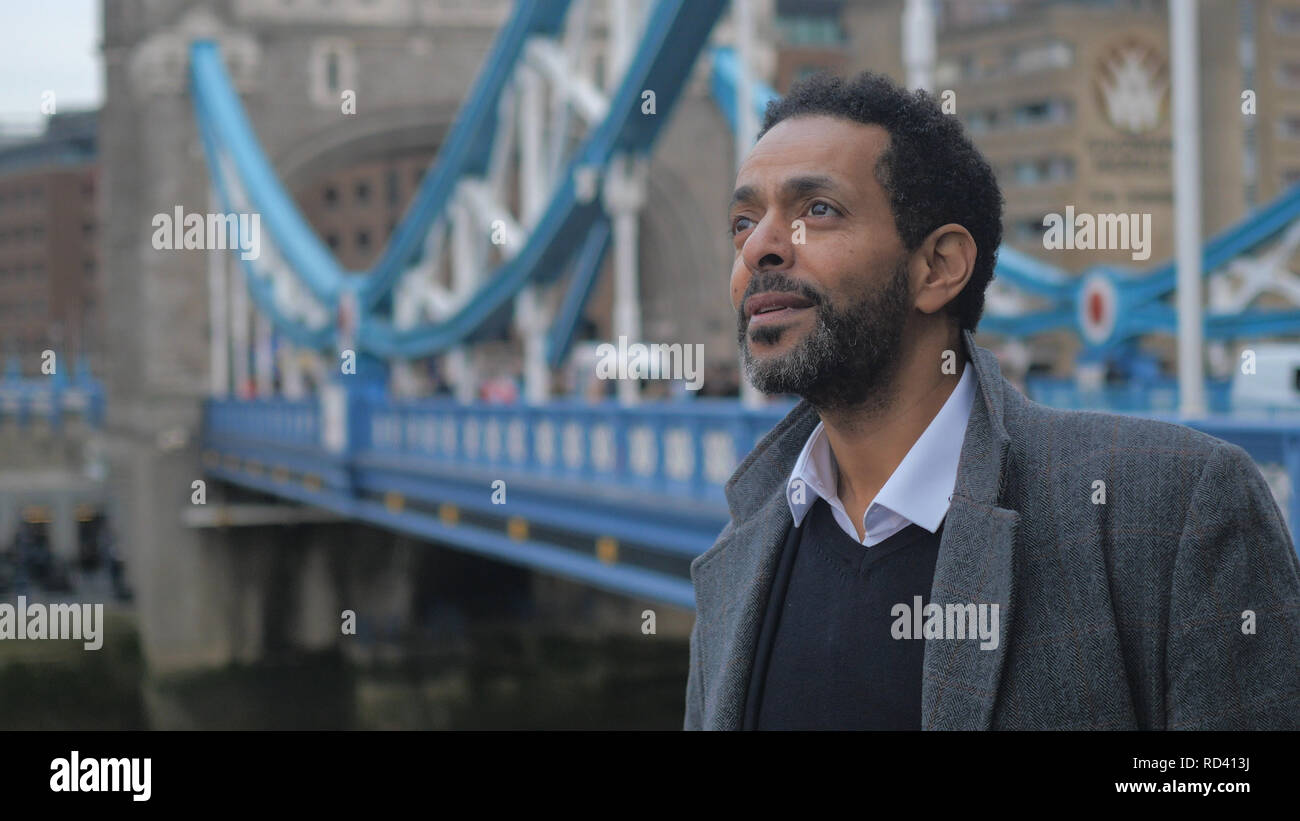Man on the Tower Bridge in London Stock Photo - Alamy