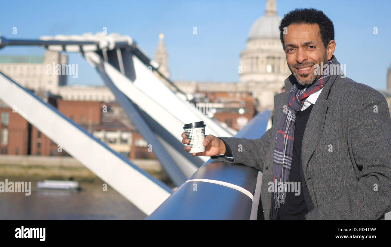 African black man enjoys the view over River Thames London from ...