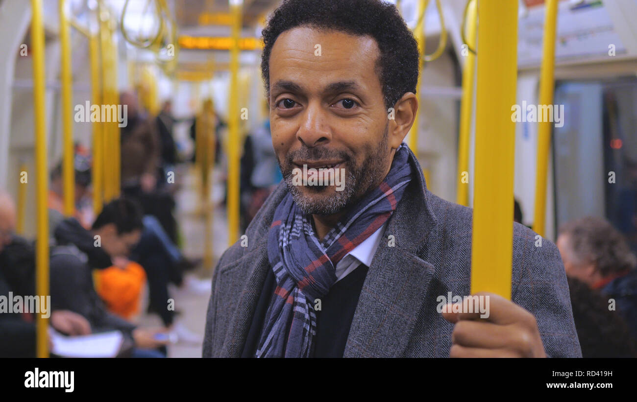 African businessman in a London underground train Stock Photo - Alamy