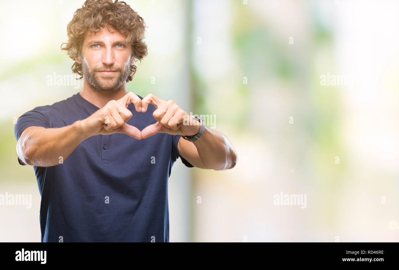 Handsome hispanic model man over isolated background smiling in love ...