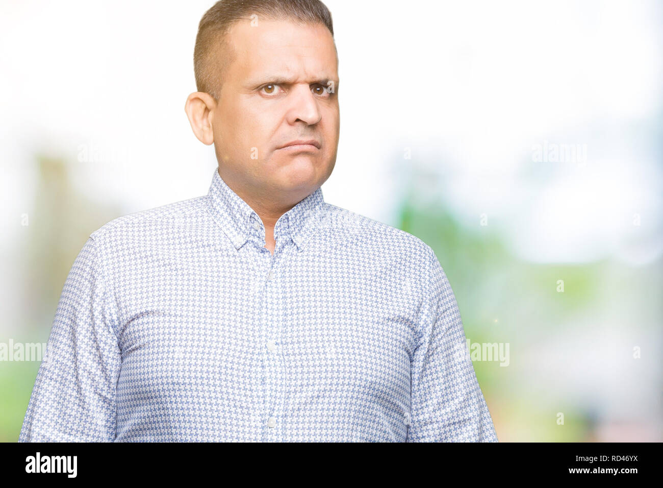 Middle age arab business man over isolated background skeptic and ...