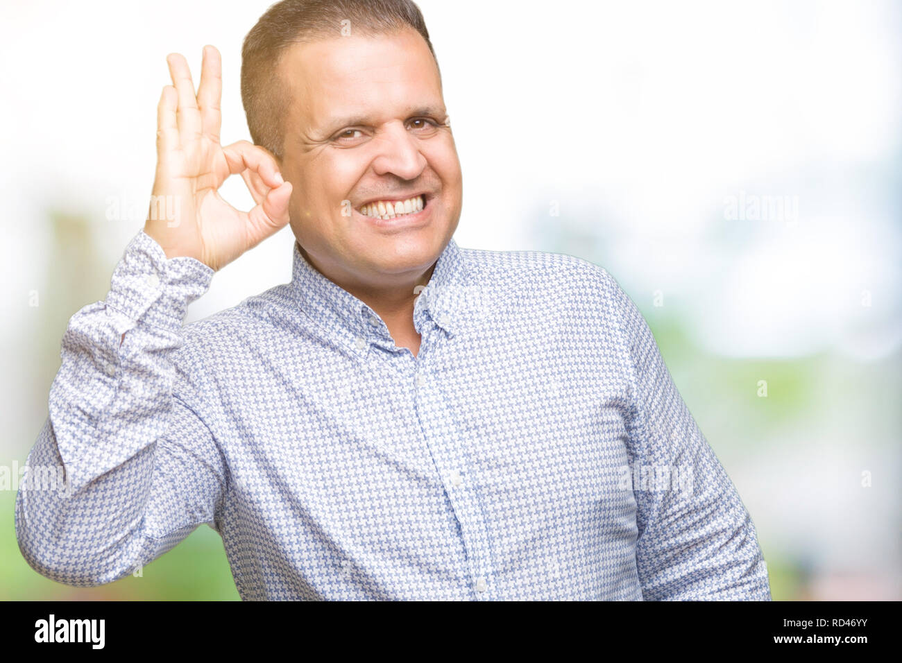Middle age arab business man over isolated background smiling positive ...