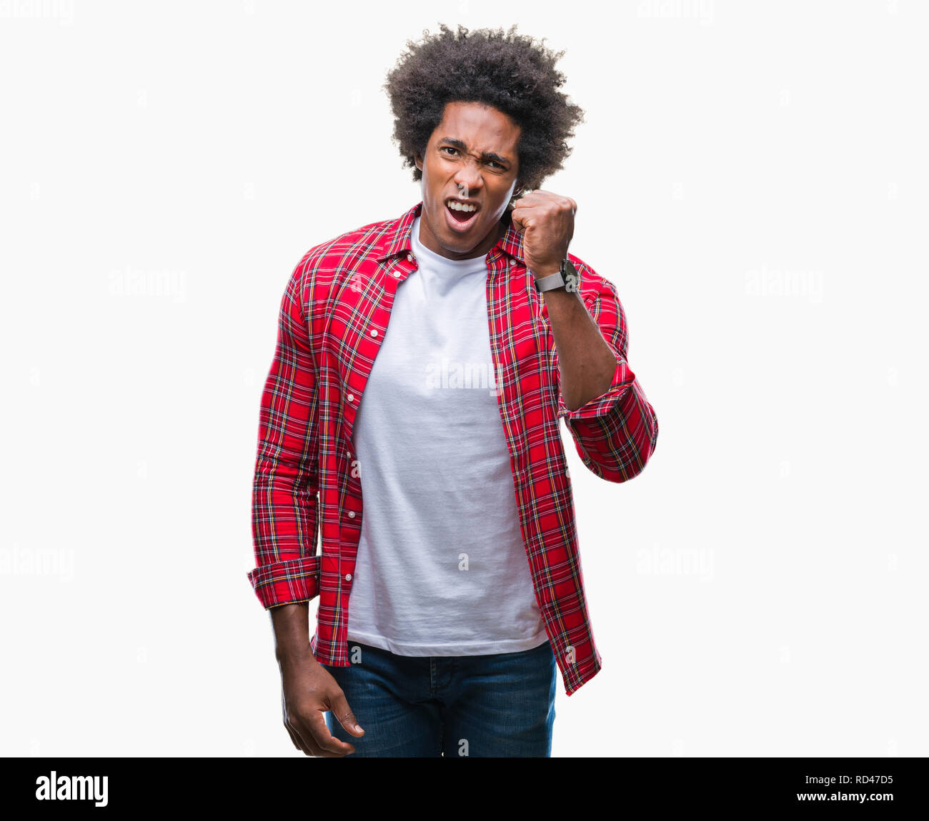 Afro american man over isolated background angry and mad raising fist ...