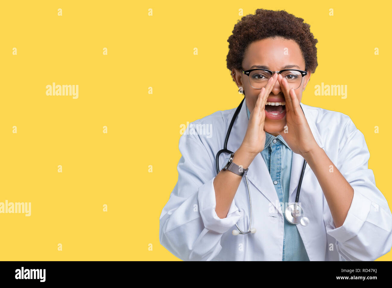 Young african american doctor woman wearing medical coat over isolated ...