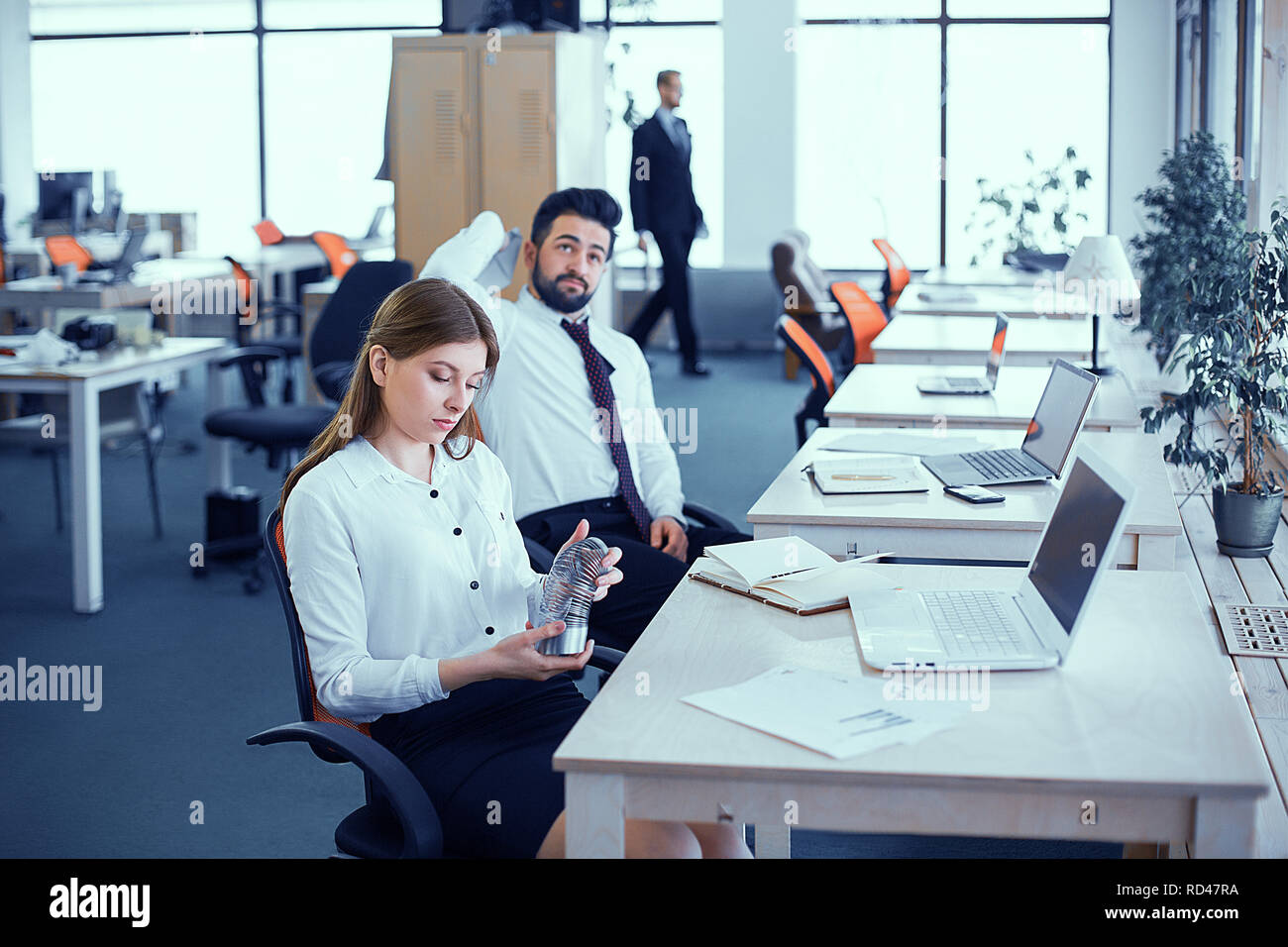 Smiling female employees work hi-res stock photography and images - Alamy