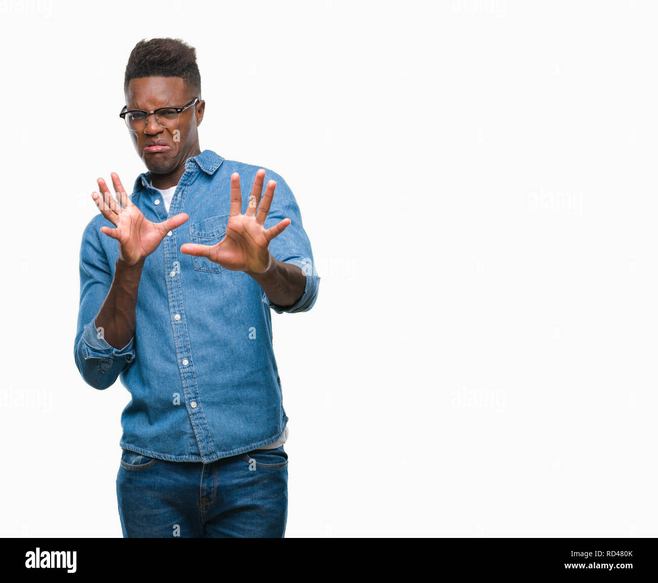 Young african american man over isolated background afraid and ...