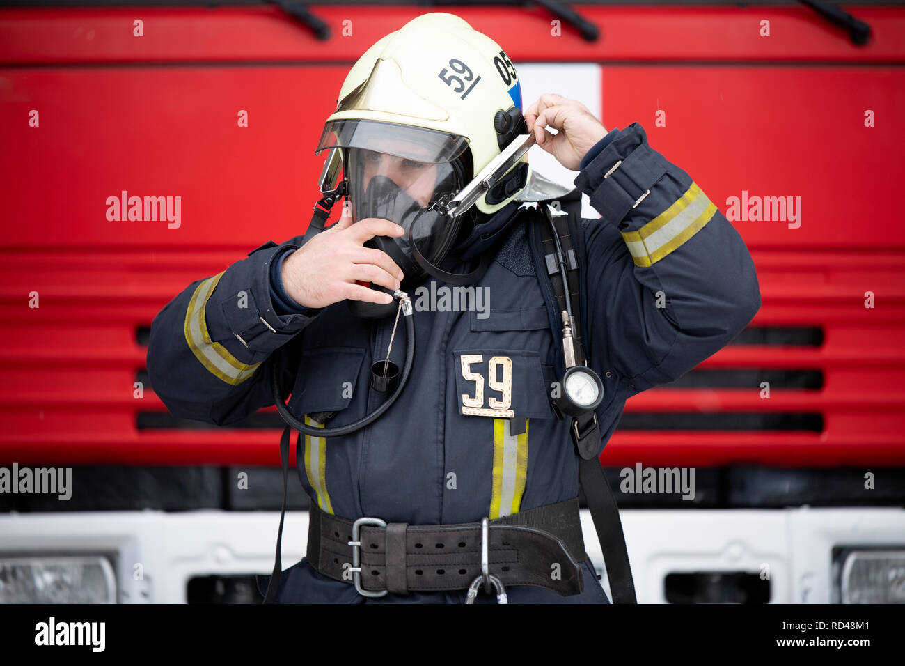 Fireman holds fire hose hi-res stock photography and images - Alamy