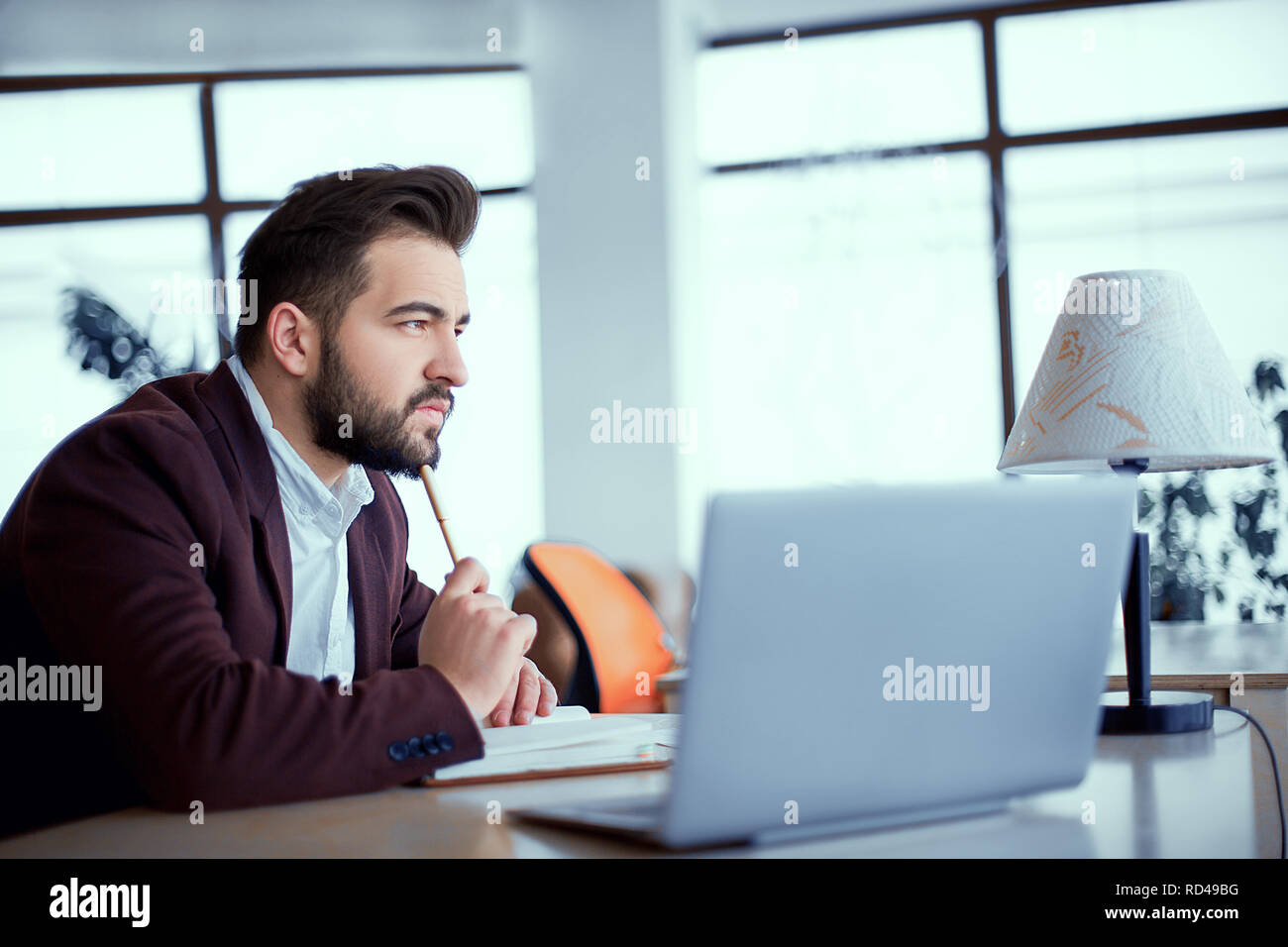 Man in office looking at computer at work hi-res stock photography and ...