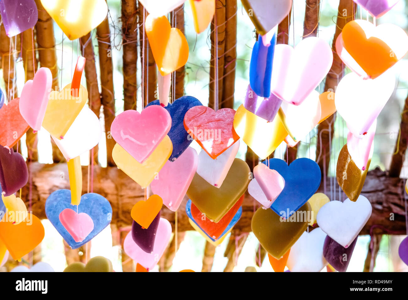 Colorful of hearts made of candle pattern designs hanging from ceiling ...