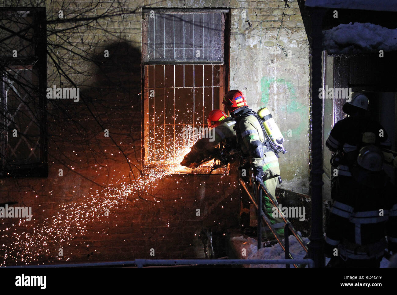 Ukrainian firemen are seen working at the scene of a fire in a ...