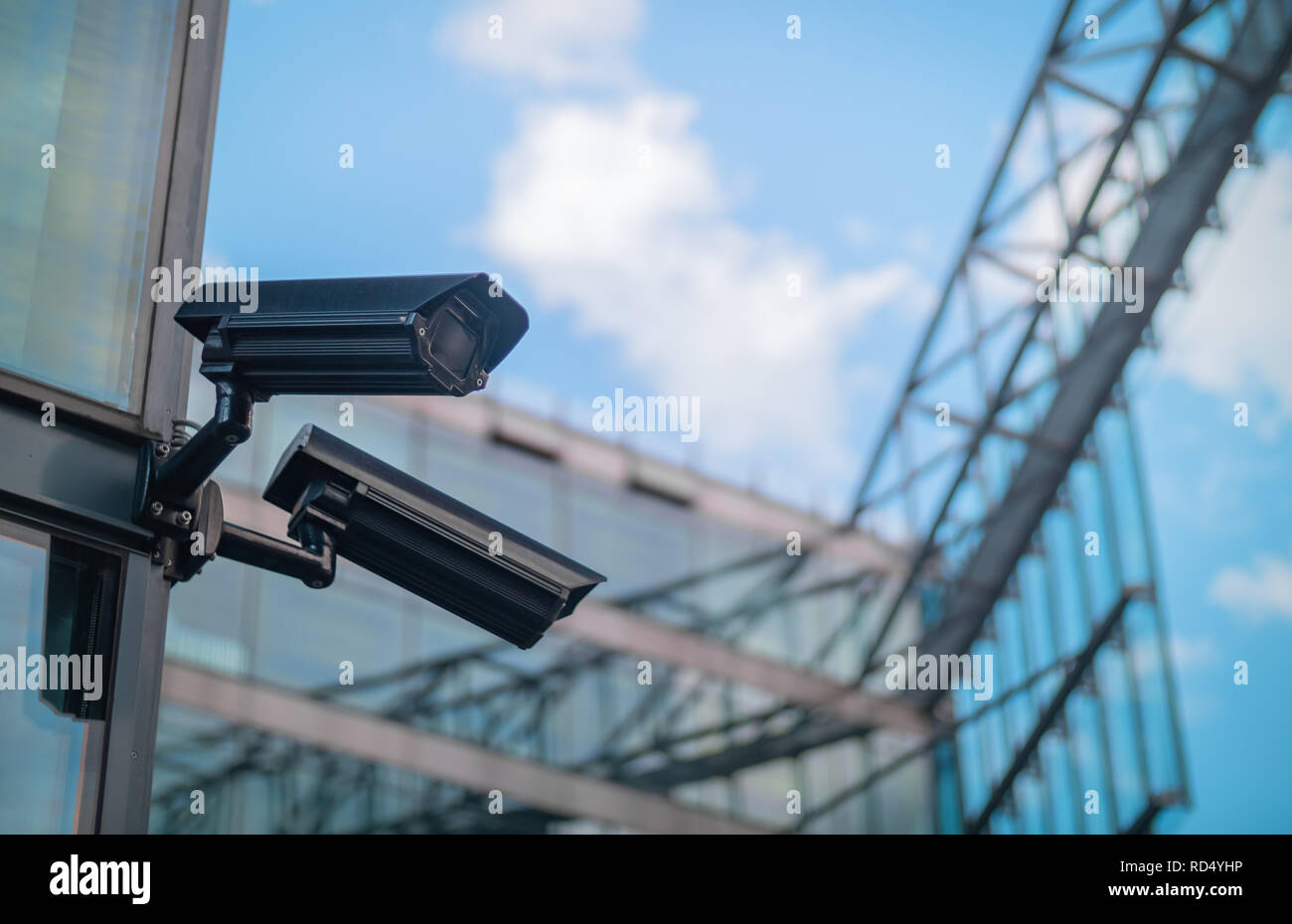 Pair of surveillance cameras on the side of a modern building Stock ...