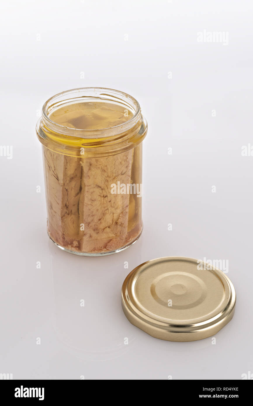 tuna preserved in glass jar in white background oil from above with ...