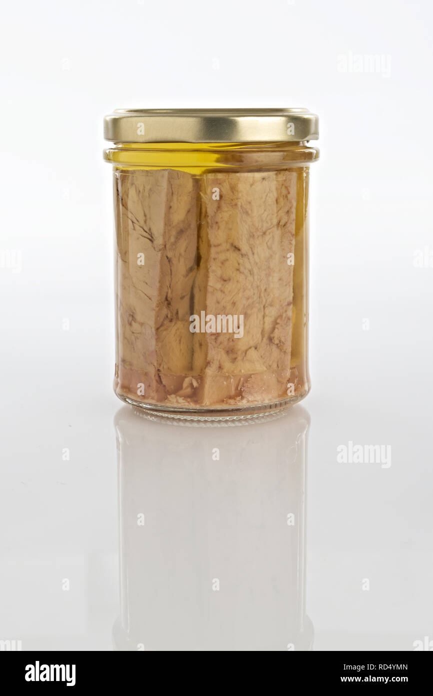 tuna preserved in glass jar in front white background oil Stock Photo ...
