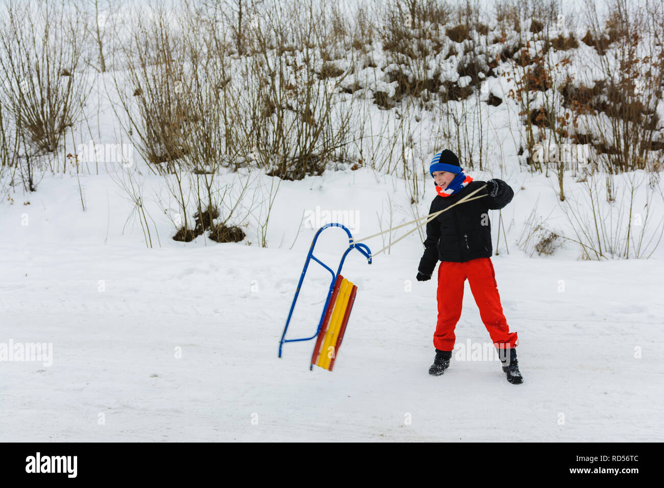 the boy throws sleds, the movement is imprisoned 2019 Stock Photo - Alamy