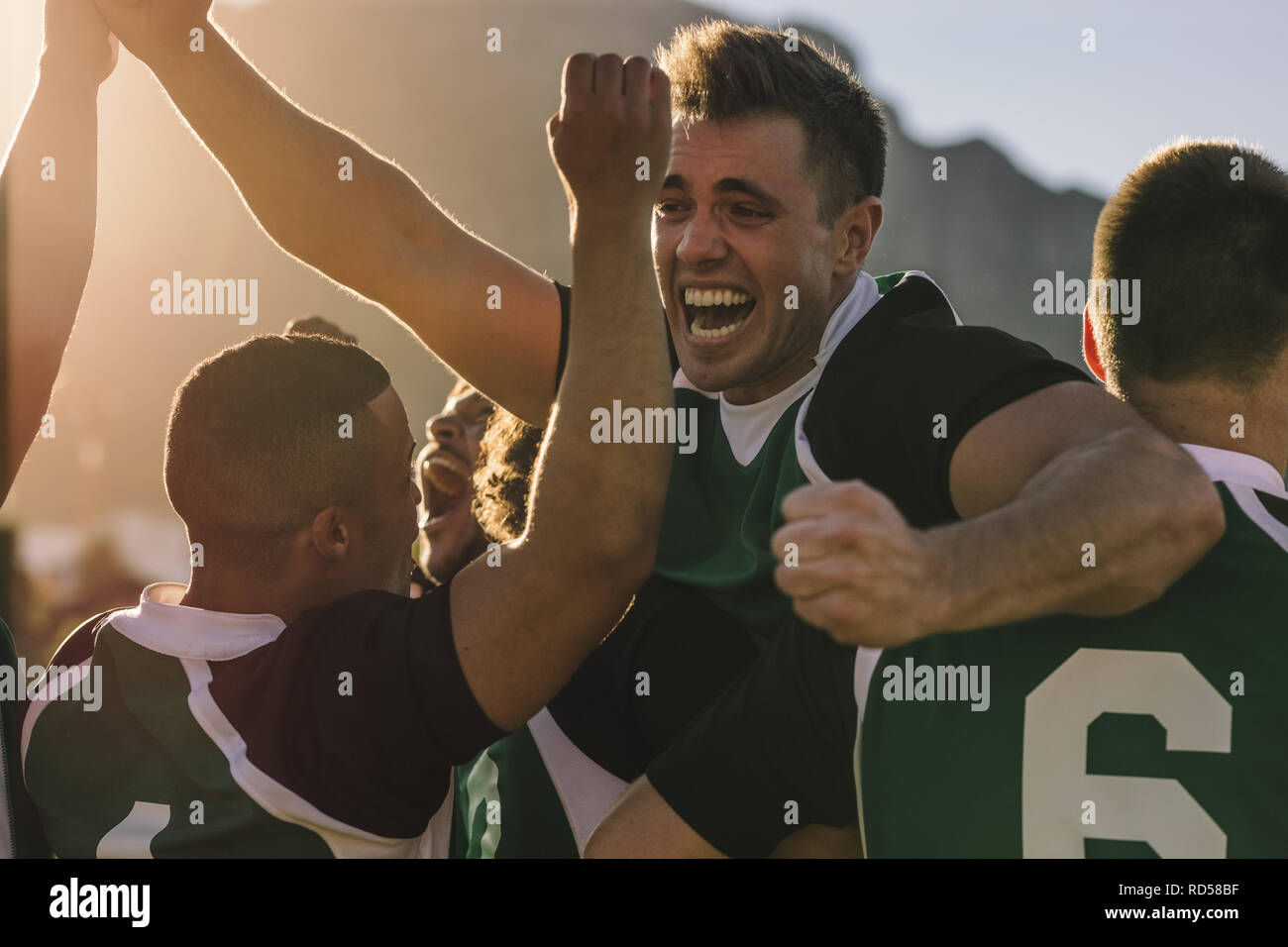 rugby team cheering and celebrating victory. rugby players cheering ...