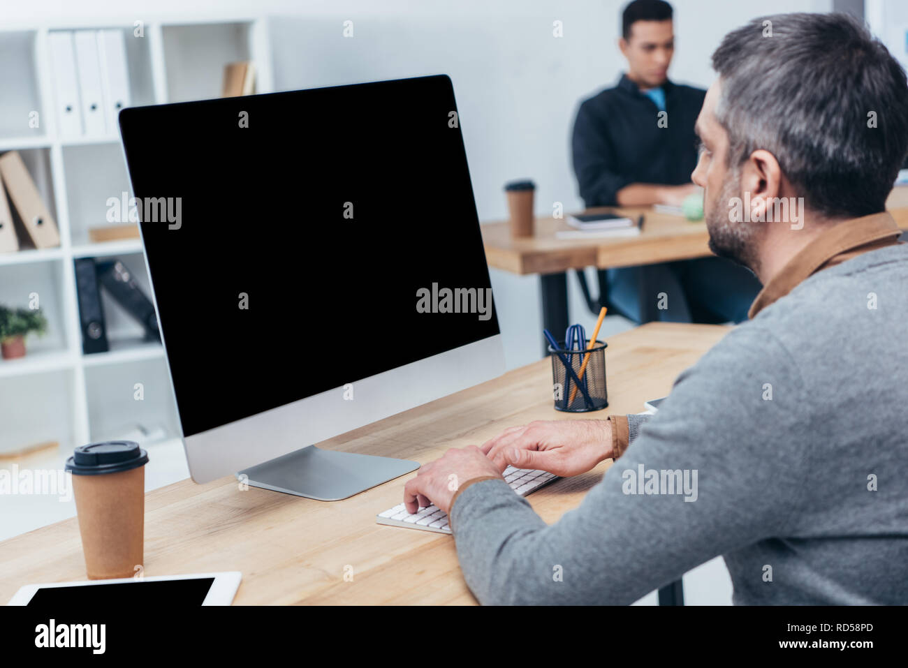 businessman using desktop computer with blank screen in office Stock ...