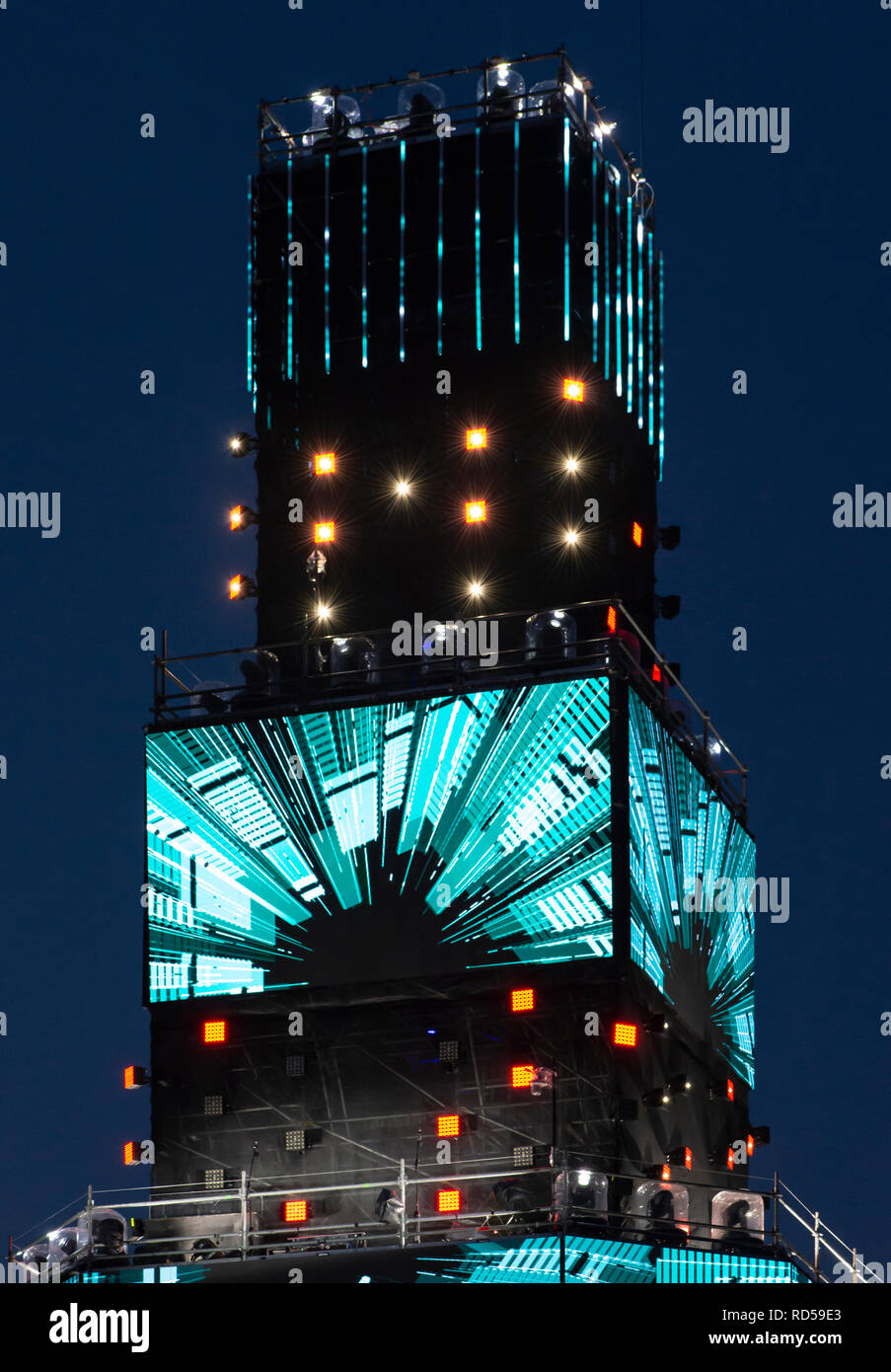 Multimedia tower with many illuminated led screens in the night. Spot ...
