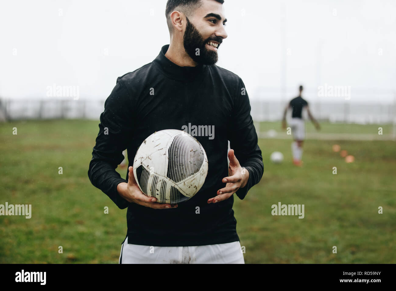 Footballer smiling hi-res stock photography and images - Alamy