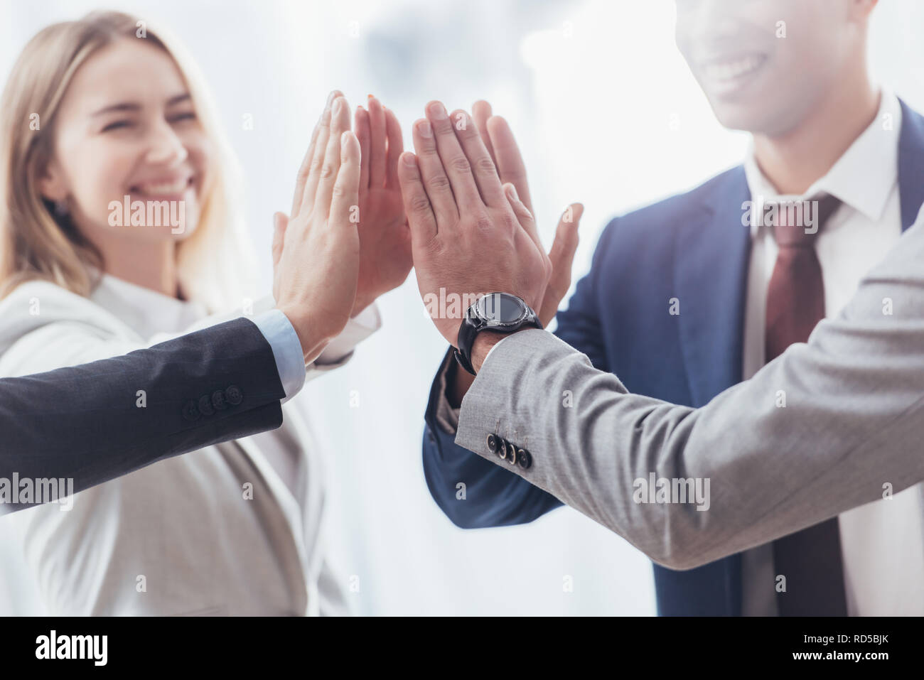 Successful managers giving high five hi-res stock photography and ...