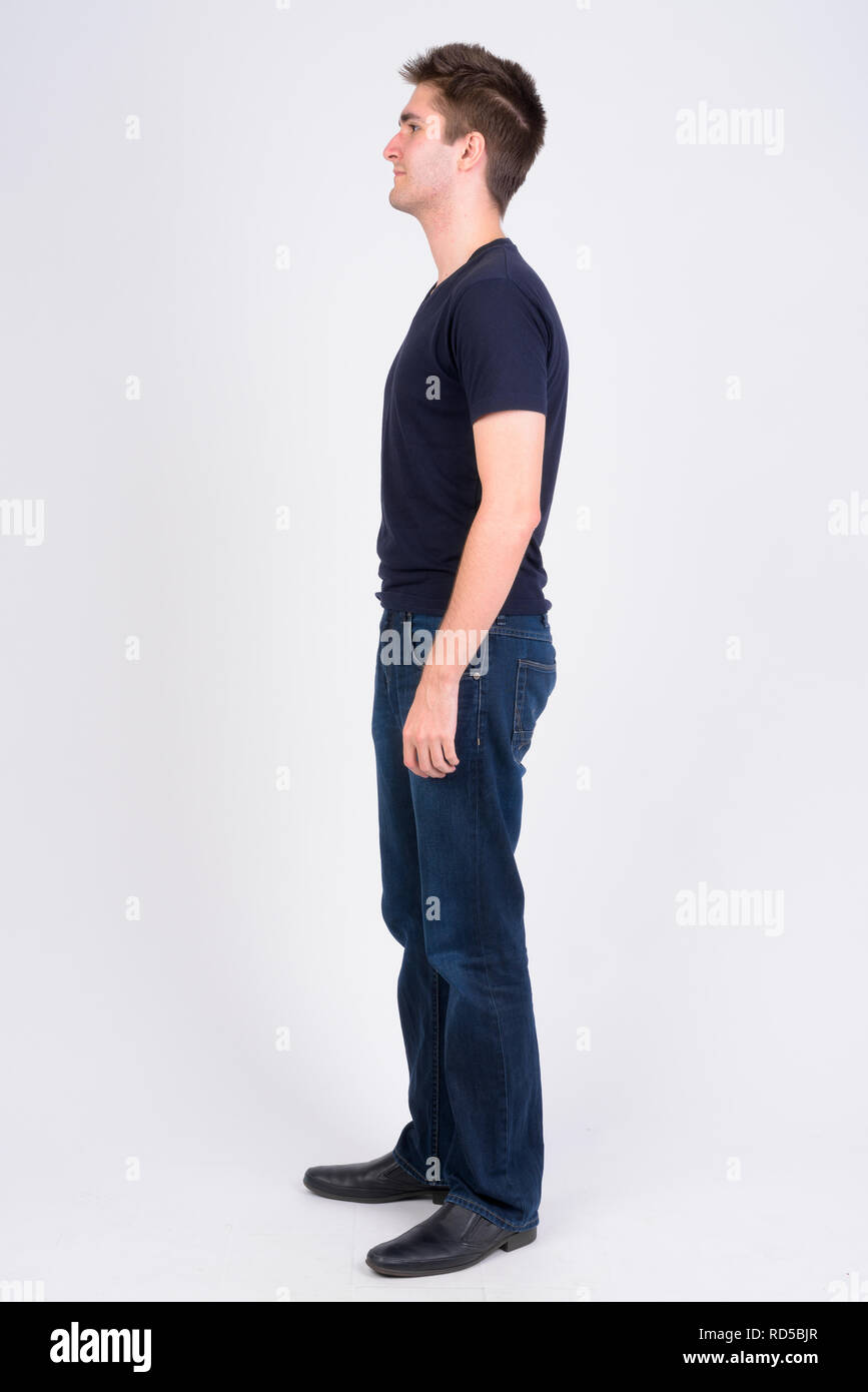 Full body shot profile view of young handsome man Stock Photo - Alamy